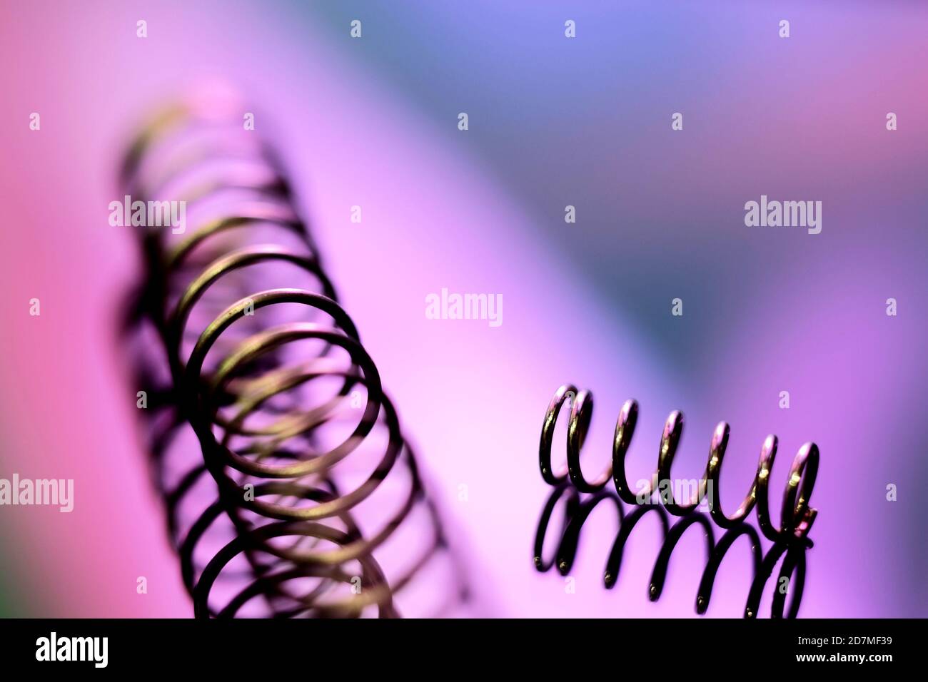 Iron spirals in blur. Shiny metal springs in blur Stock Photo - Alamy