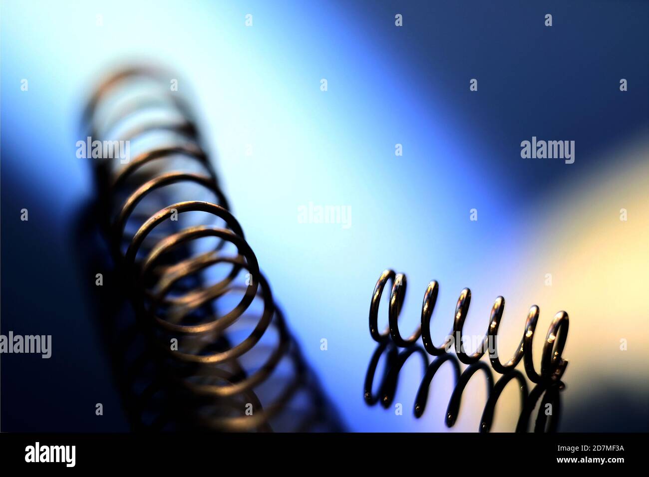 Iron spirals in blur. Shiny metal springs in blur Stock Photo - Alamy