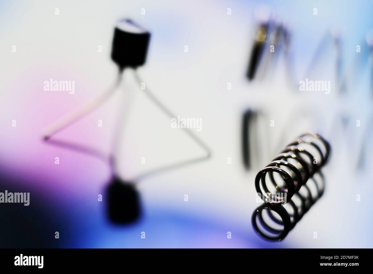 Iron spirals in blur. Shiny metal springs in blur Stock Photo - Alamy