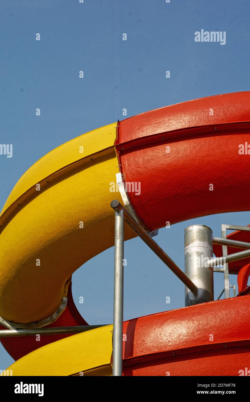 Vertical closeup shot of a turning red and yellow waterslide Stock ...