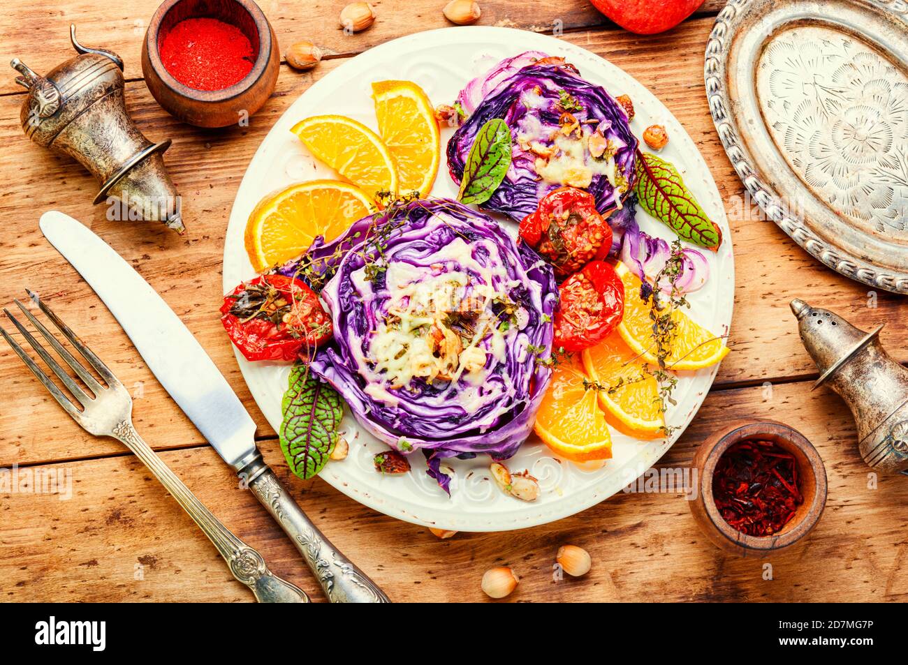 Vegetable steak from red cabbage baked with orange and hazelnuts Stock ...