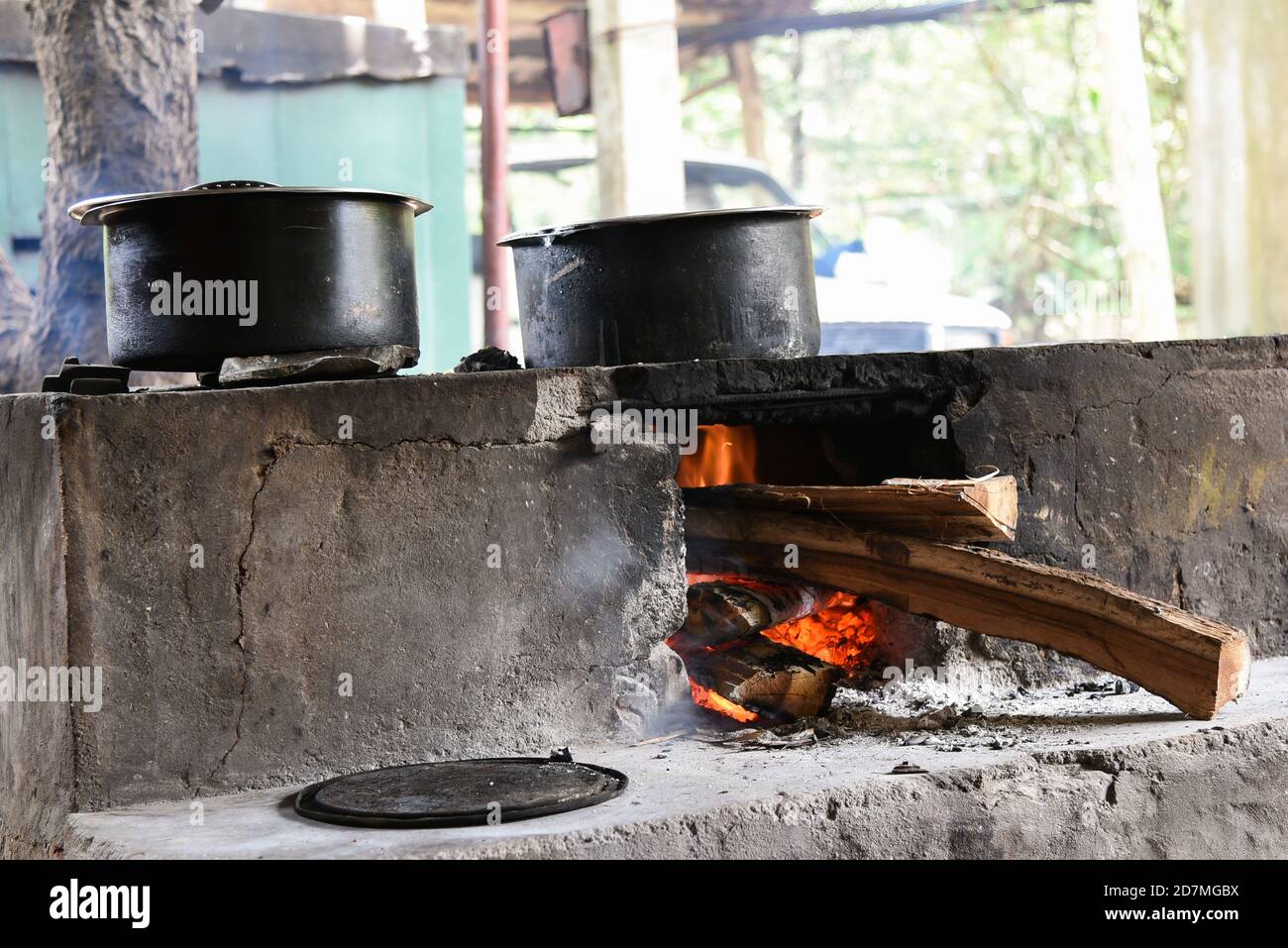 Traditional old vintage Indian kitchen with burning wood to make fire ...