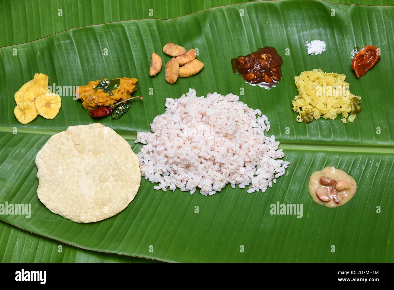 Onam sadhya, Indian women eating with hand boiled rice, served for ...