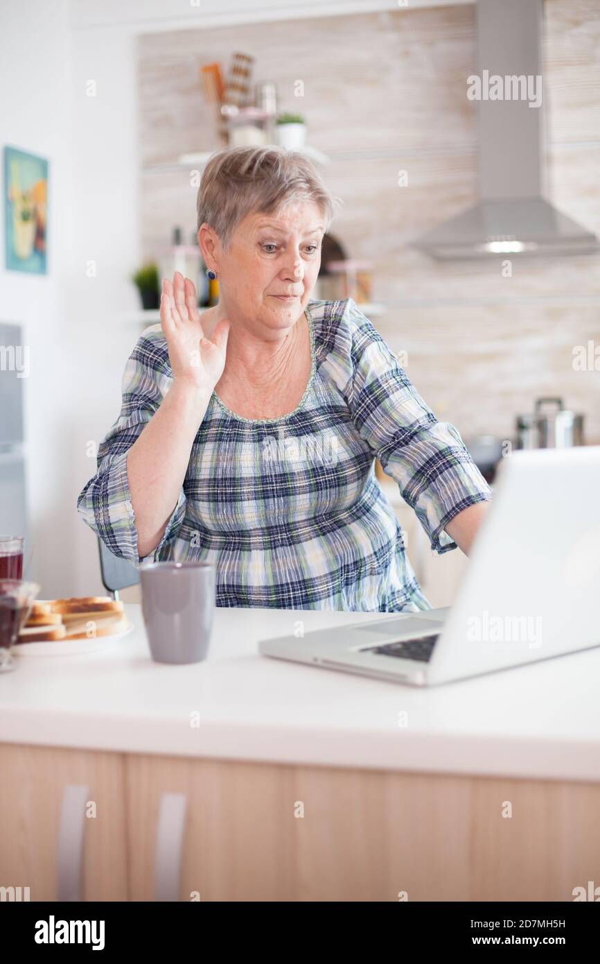 Old women using computer in kitchen hi-res stock photography and images ...