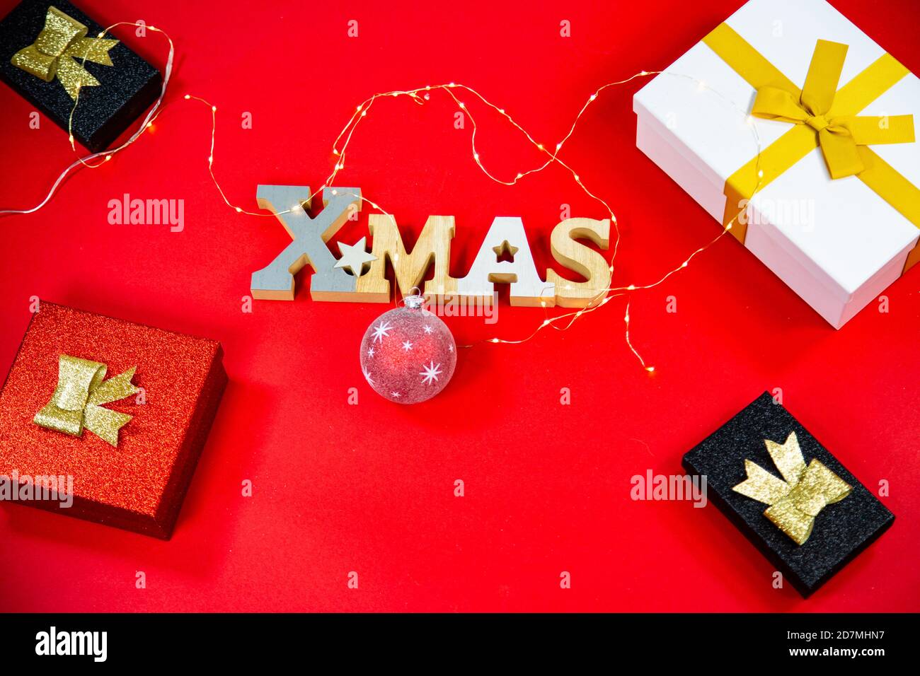 Christmas presents on a red background Stock Photo - Alamy