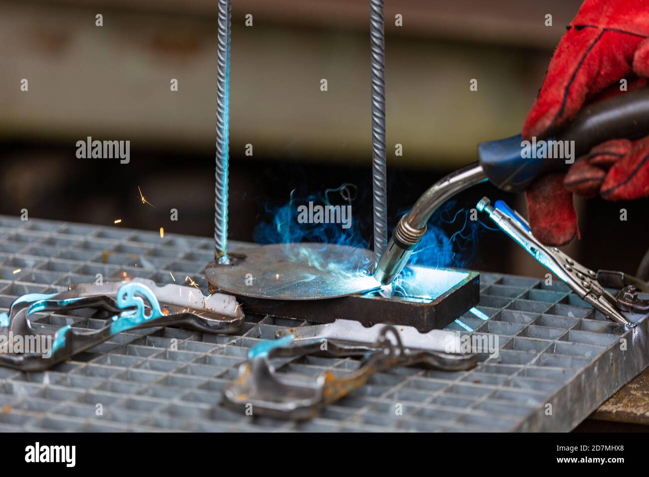 Details of welding activities - a welder is welding steel compon Stock ...