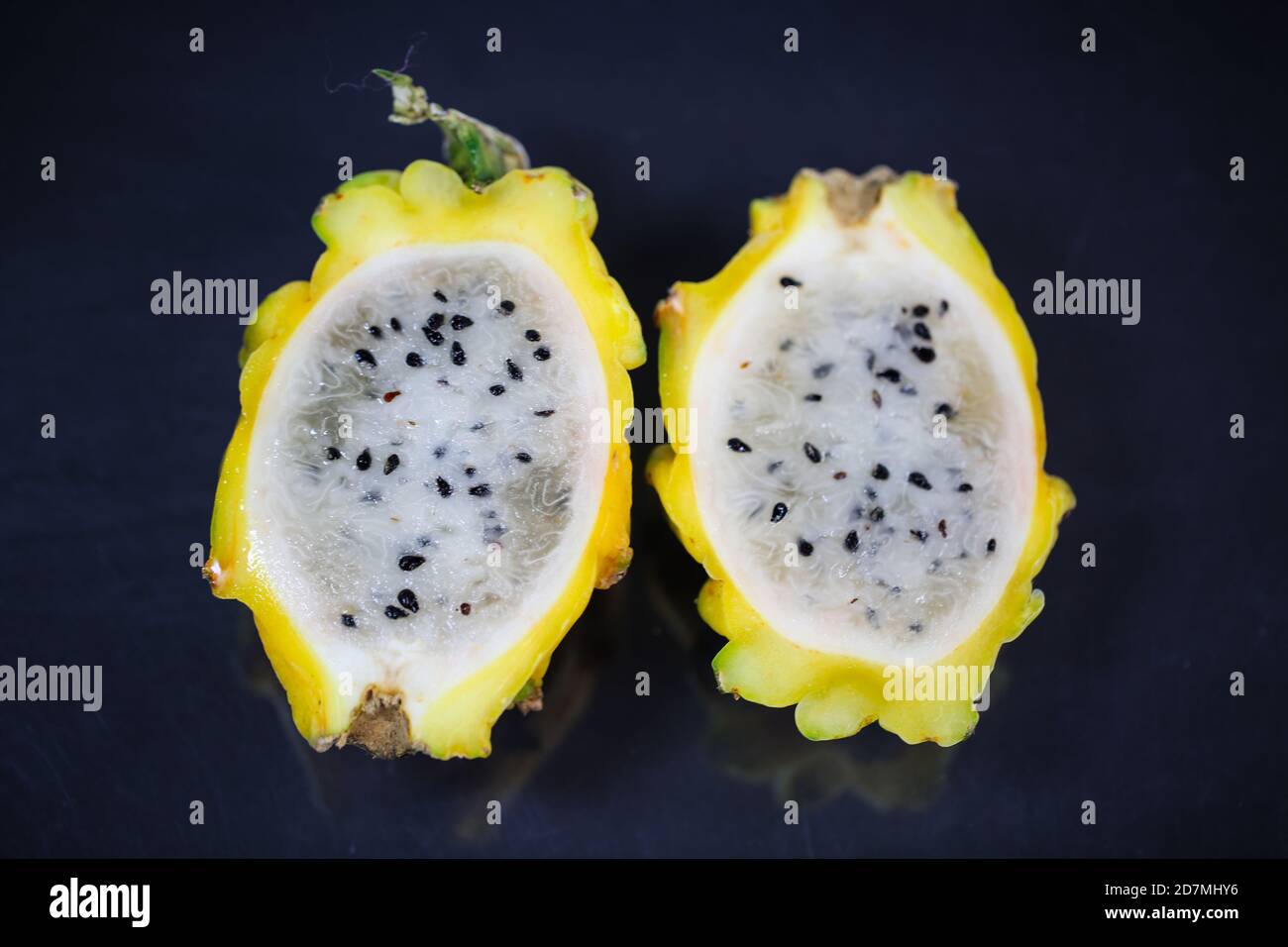 yellow pitahaya on black background Stock Photo - Alamy