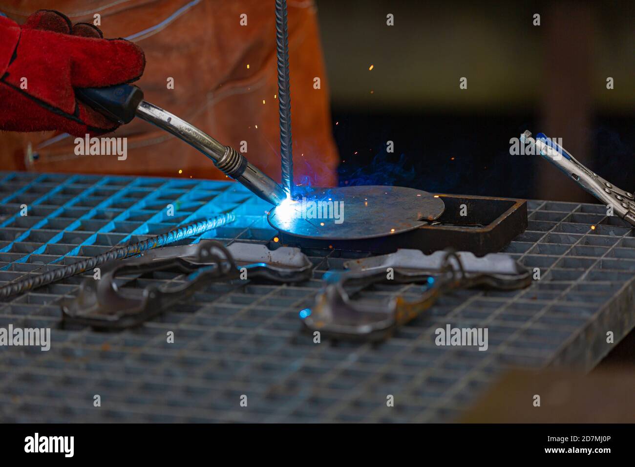 Details of welding activities - a welder is welding steel compon Stock ...