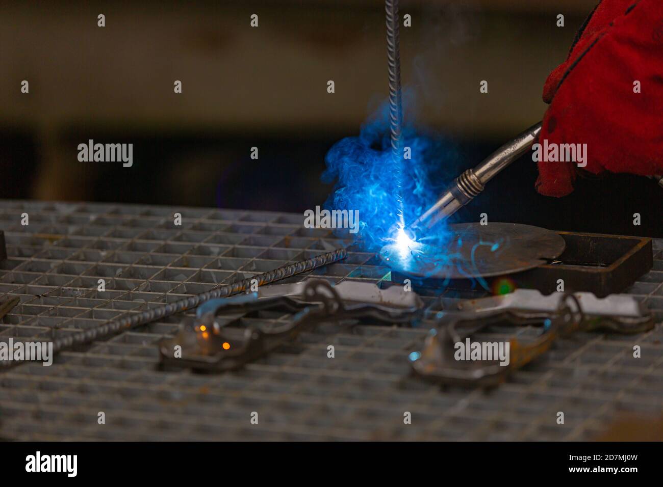 Details of welding activities - a welder is welding steel compon Stock ...