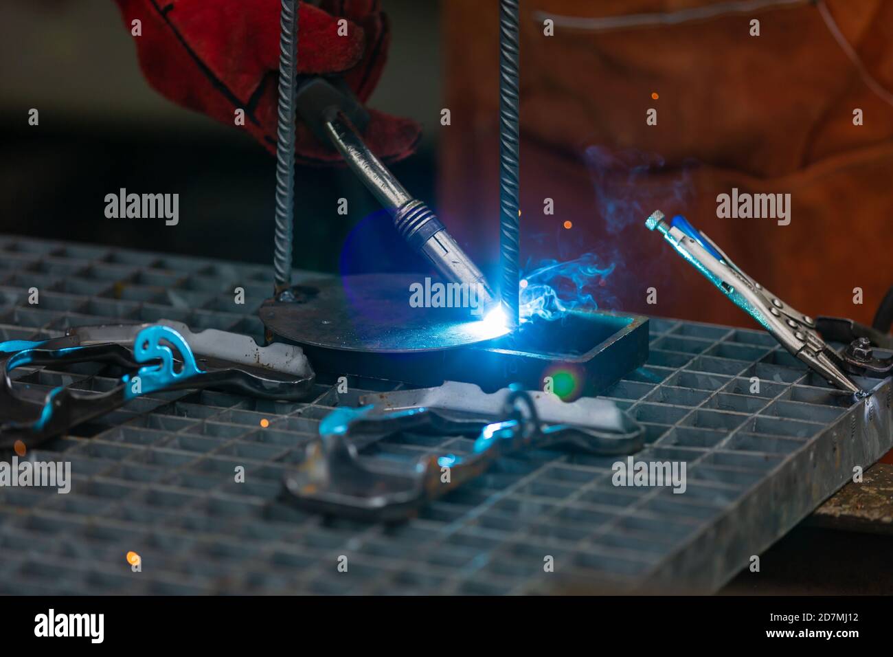 Details of welding activities - a welder is welding steel compon Stock ...
