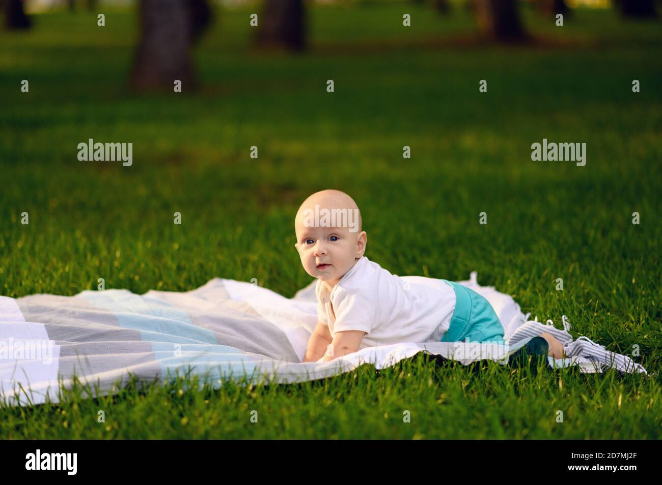 Baby lying in the sun hi-res stock photography and images - Alamy
