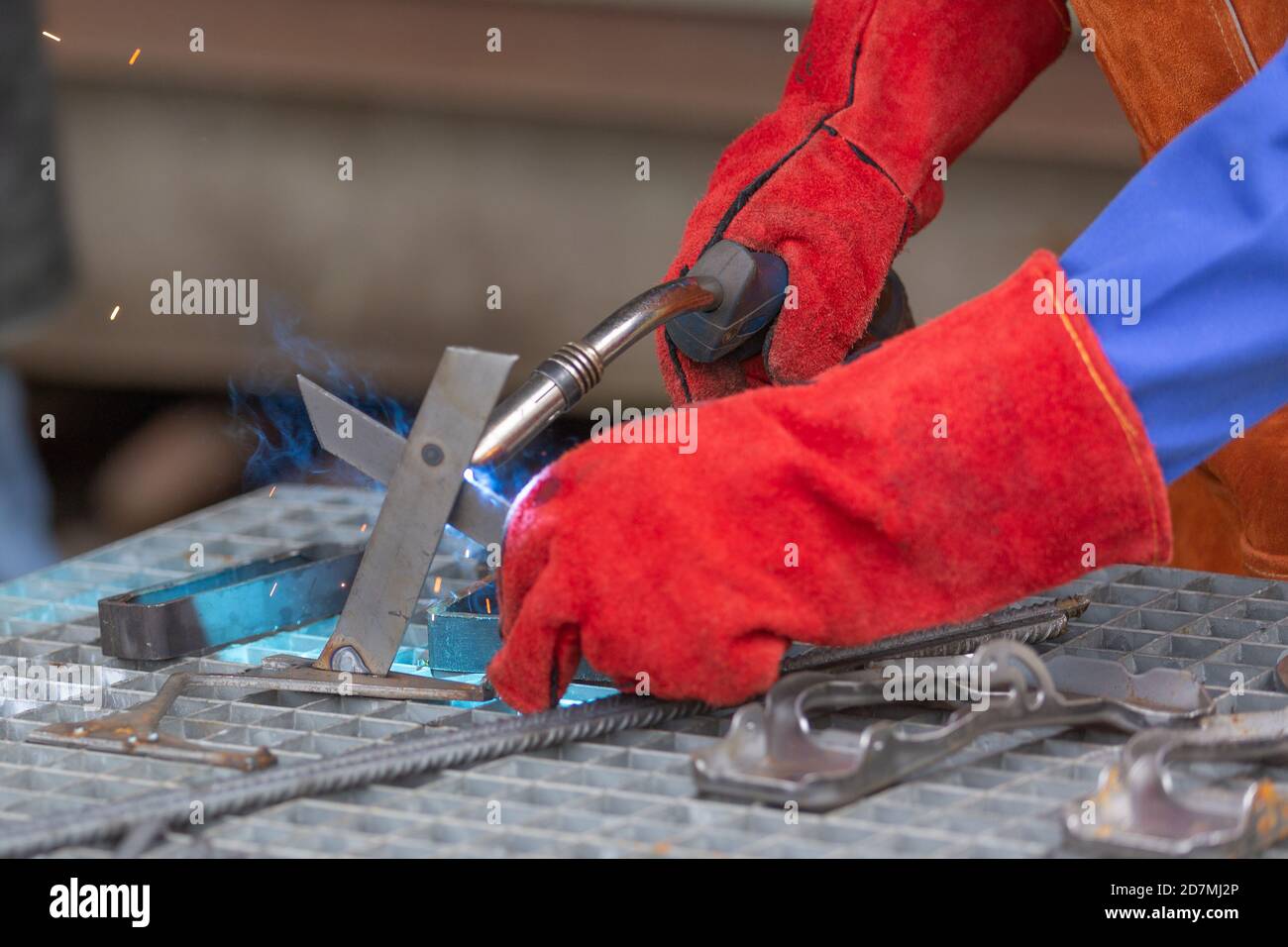 Details of welding activities - a welder is welding steel compon Stock ...