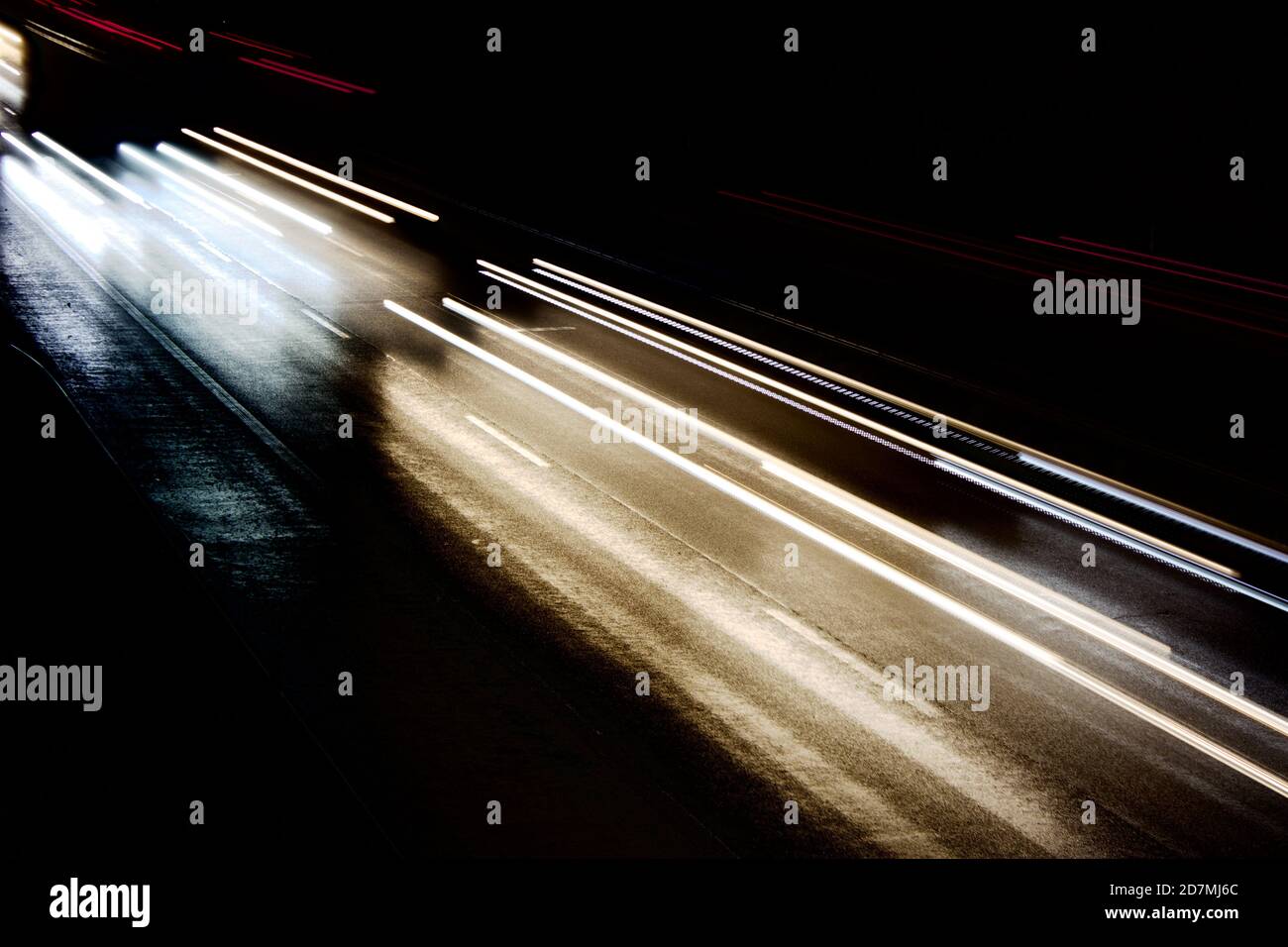 cars moving fast on a dark and wet highway Stock Photo - Alamy