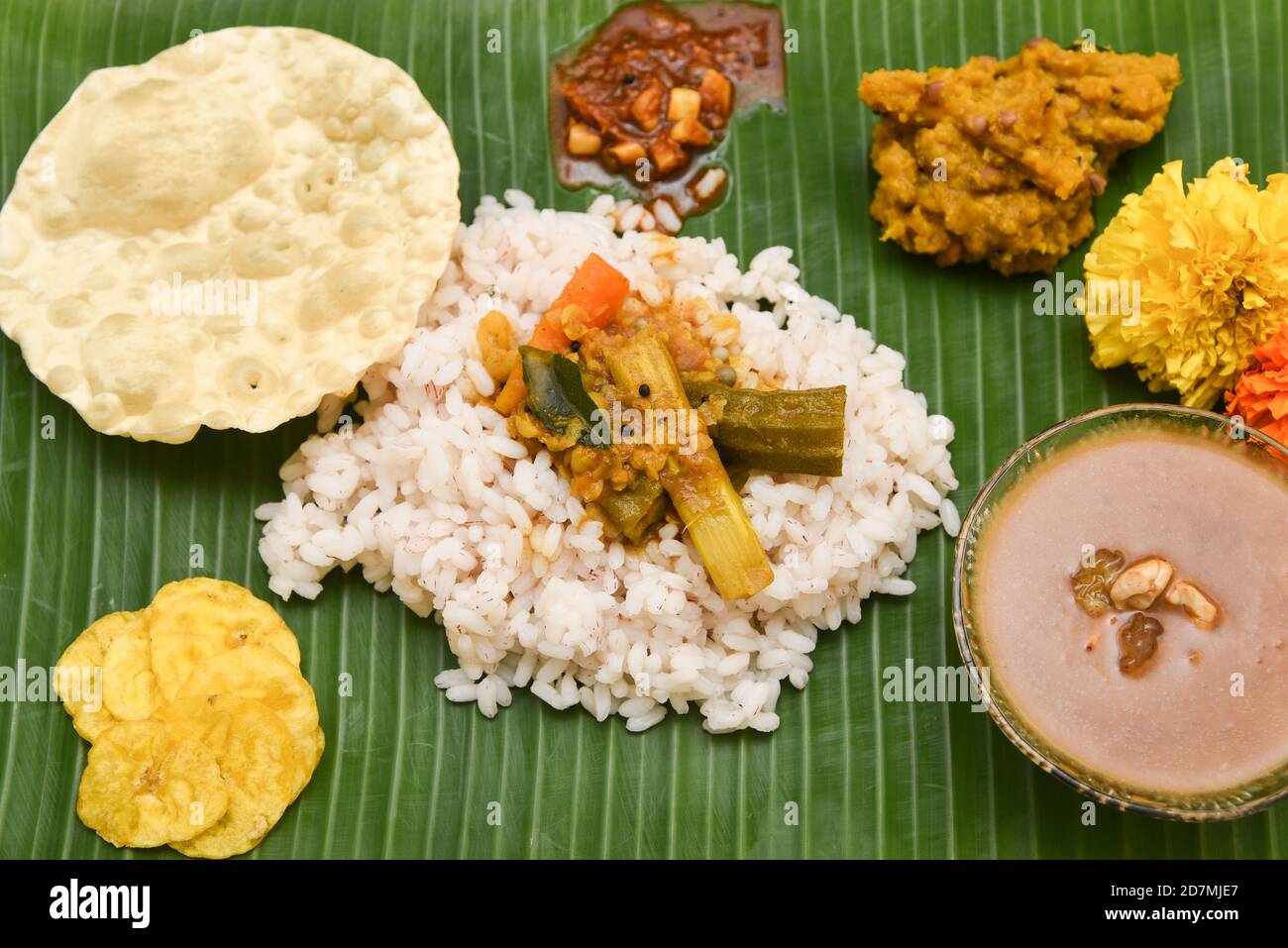 Onam sadhya, Indian women eating with hand boiled rice, served for ...