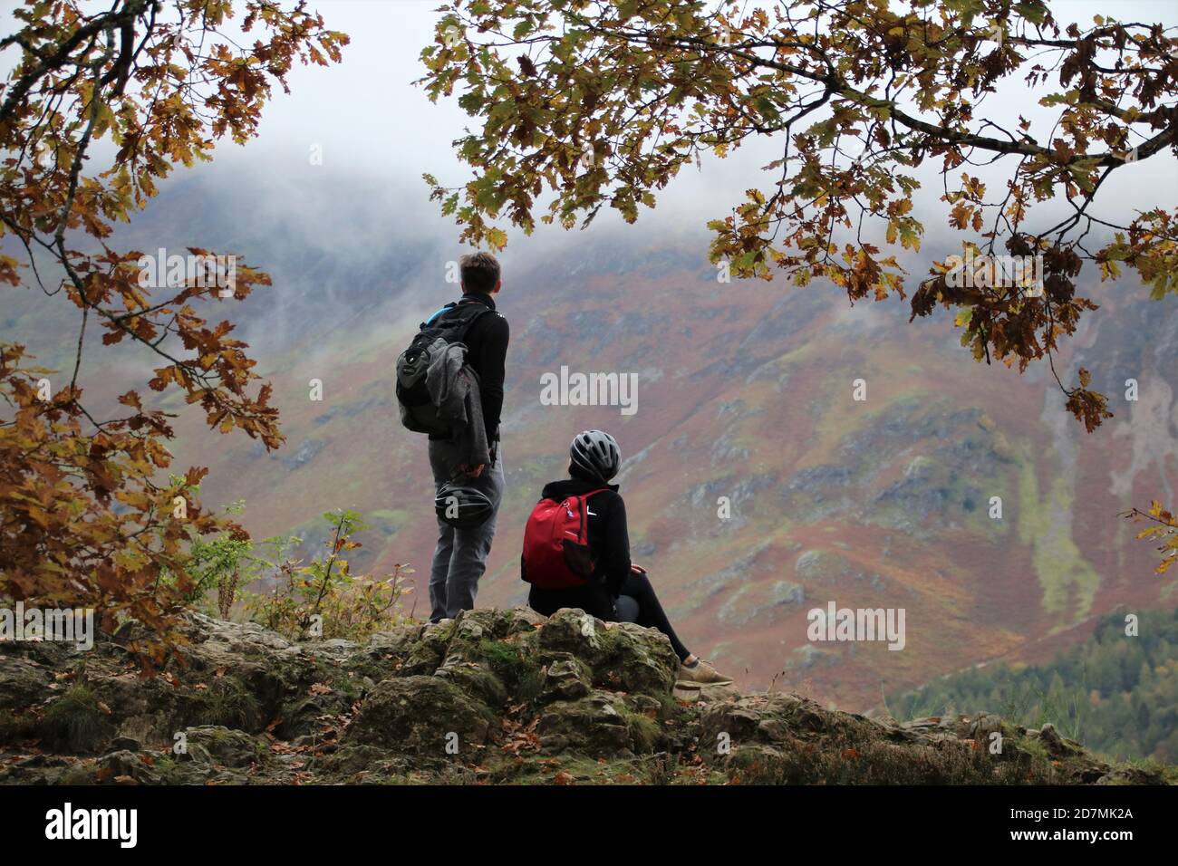 two people looking out over mountains Stock Photo - Alamy