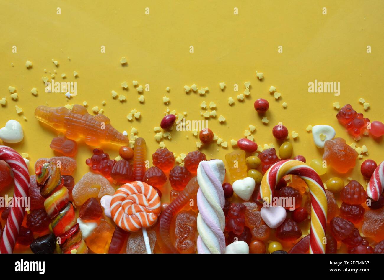 candies with jelly and sugar. colorful array of different childs sweets ...