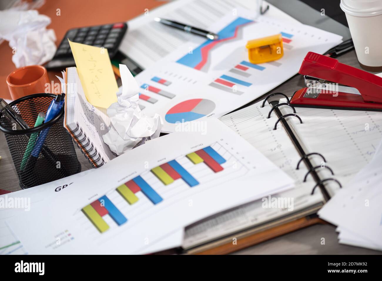 Messy and cluttered office desk Stock Photo - Alamy