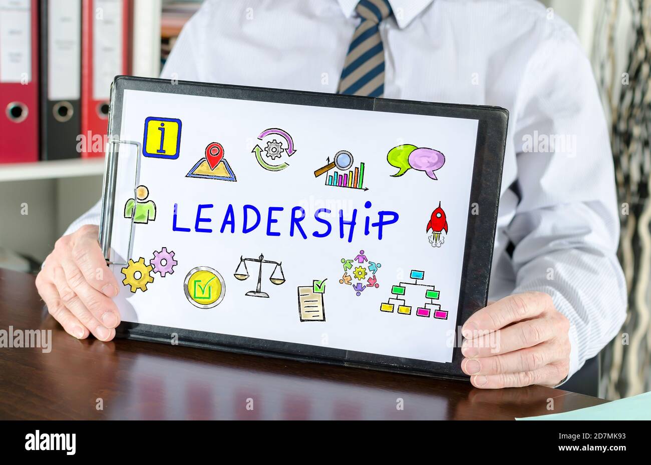 Leadership concept shown by a businessman Stock Photo - Alamy