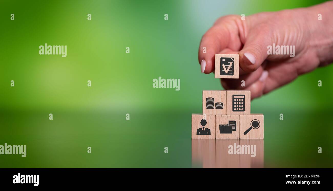 Concept of accounting with icons on wooden cubes Stock Photo - Alamy