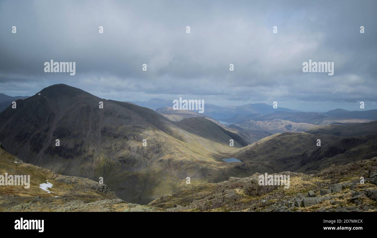 climbing up scafell pike in the lake district, england Stock Photo - Alamy