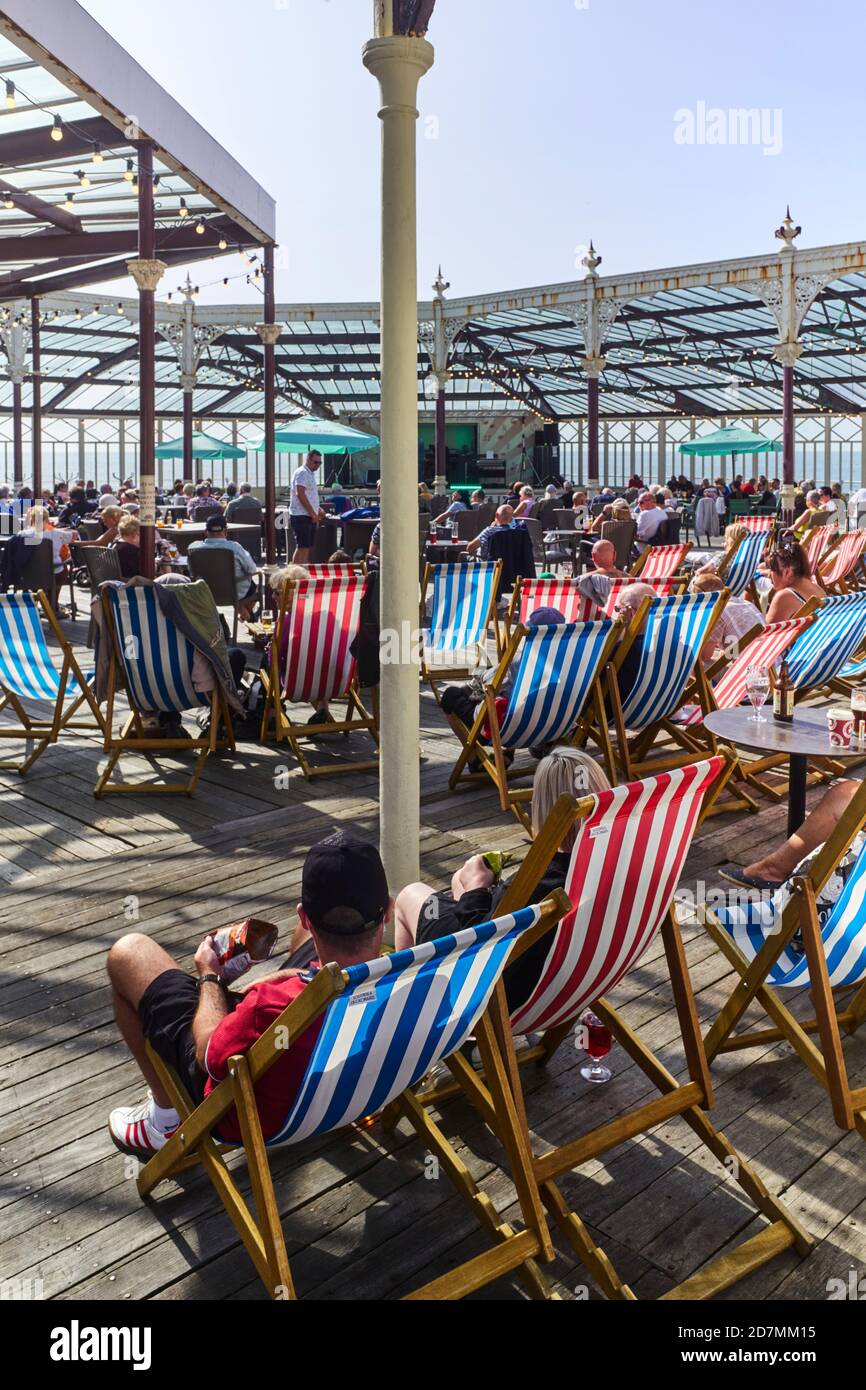 The concert area with people sitting in deckchairs at the end of the ...