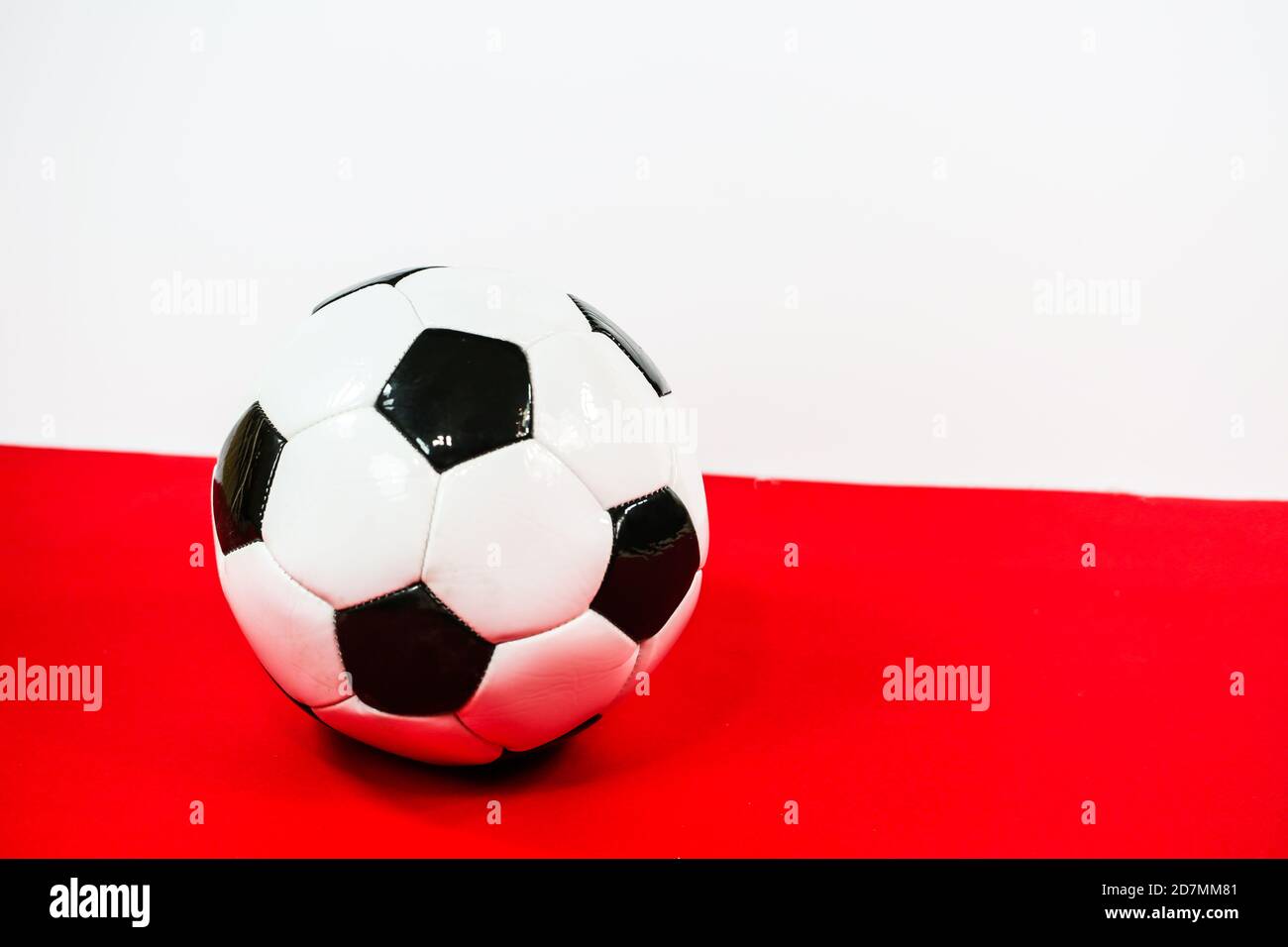 Football on red white background Stock Photo - Alamy