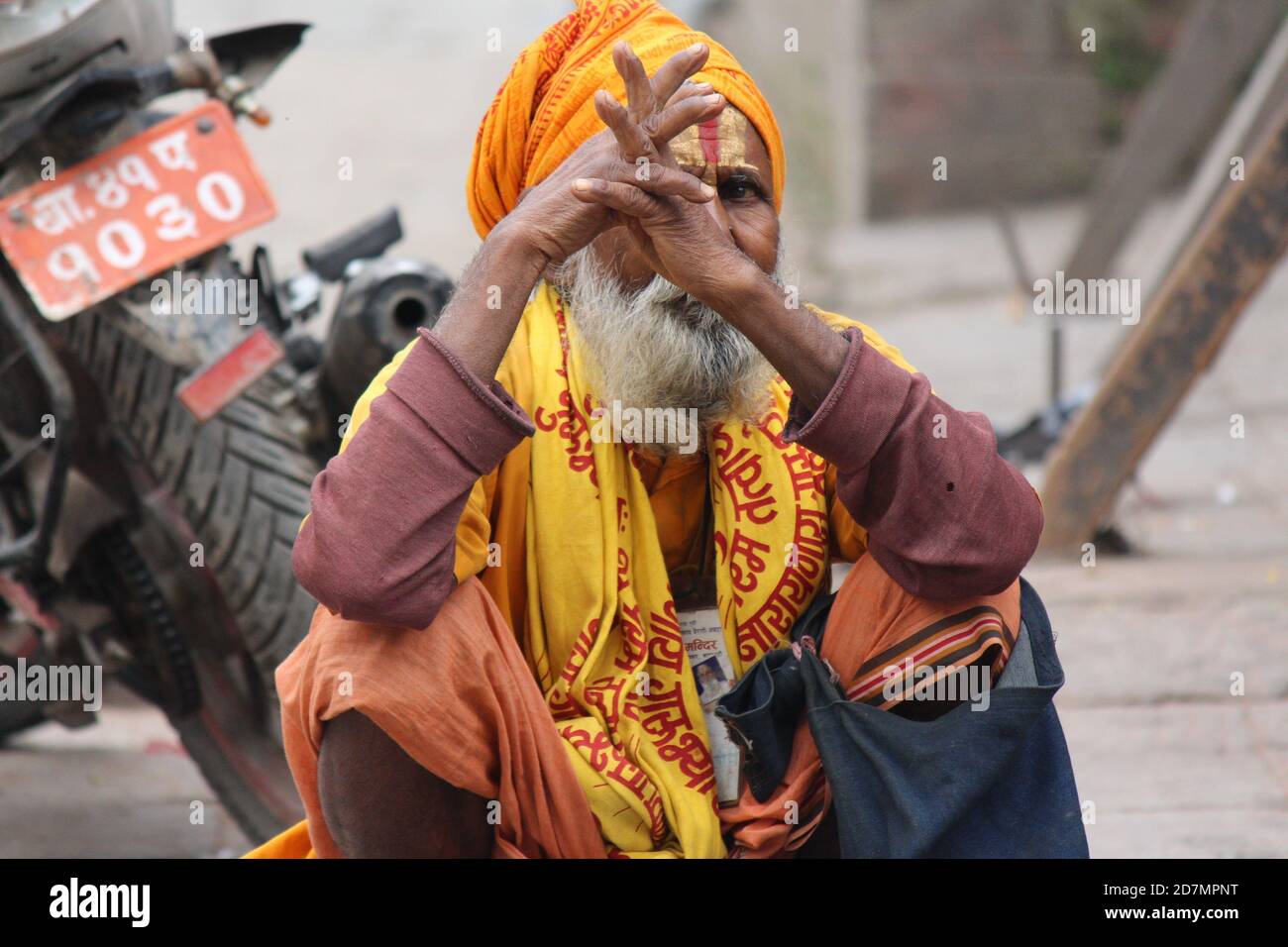 Man waiting by the road in India Stock Photo - Alamy