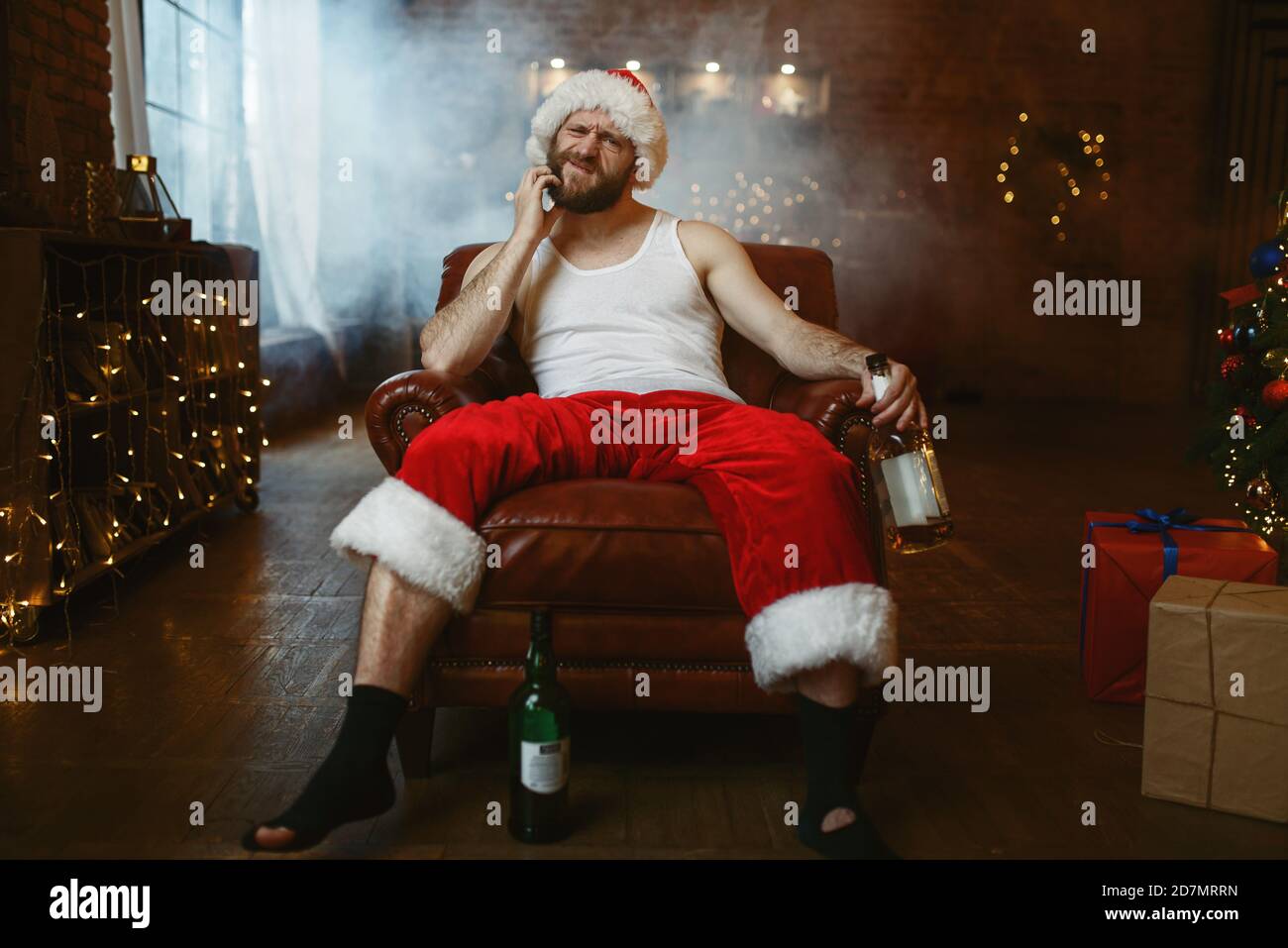 Bad Santa claus drinks alcohol, nasty party Stock Photo - Alamy