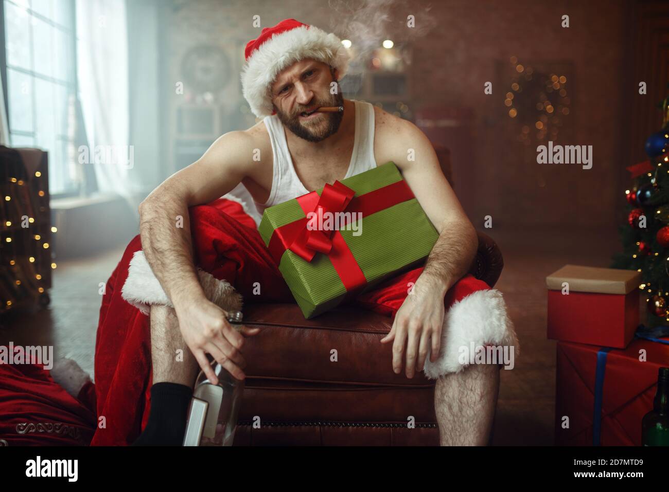 Portrait of Bad Santa smoking a cigar Stock Photo - Alamy