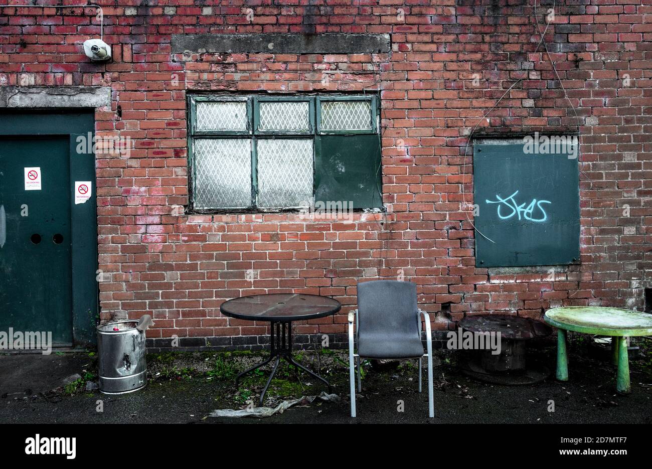Old single storey brick built industrial building in decaying state ...