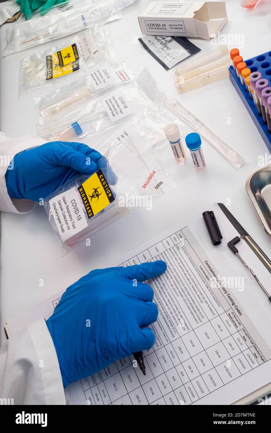 Nurse comparing positive covid-19 test results of infected persons ...