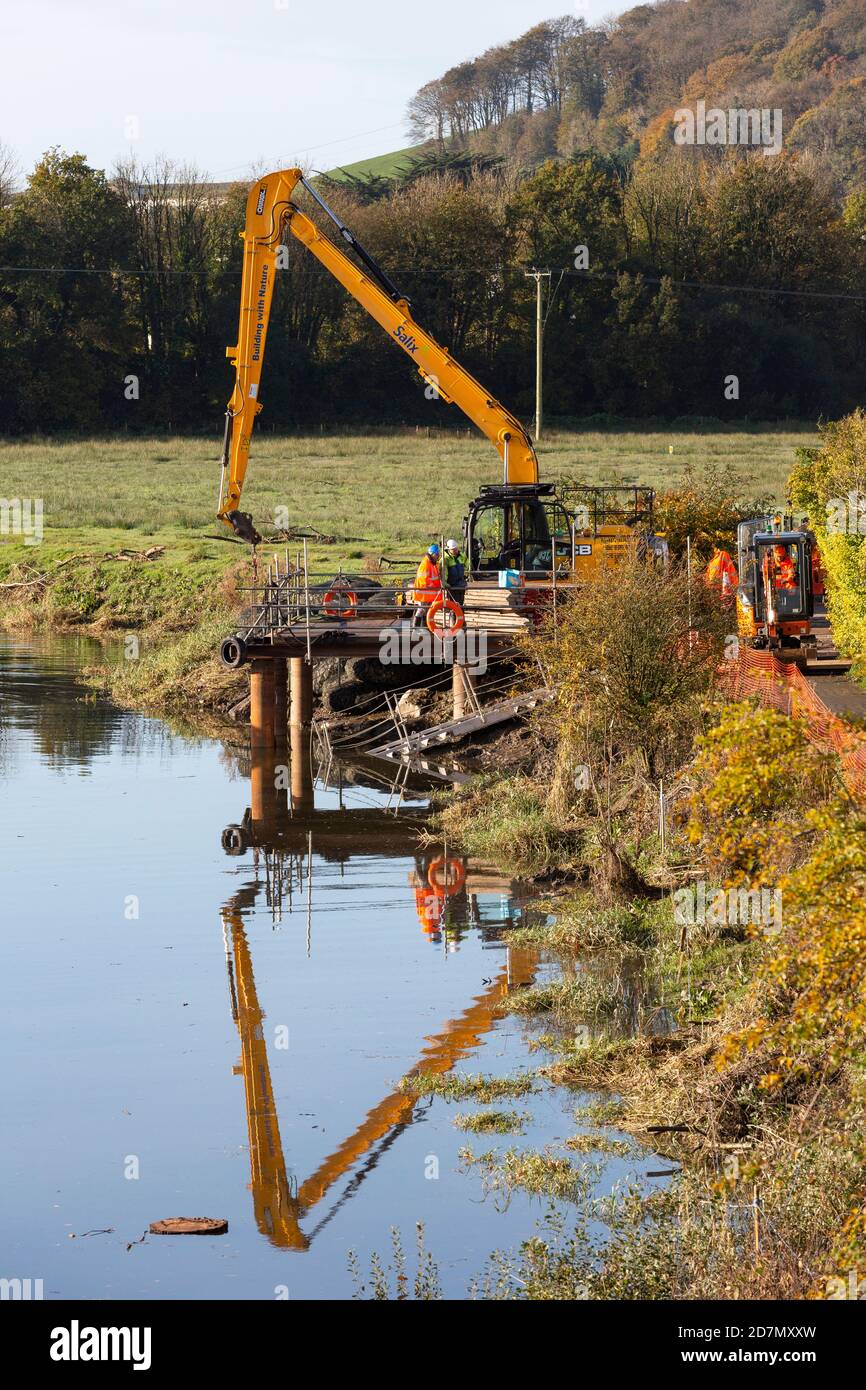 Plant, machinery, boats, barges and workmen on the Towy River in ...