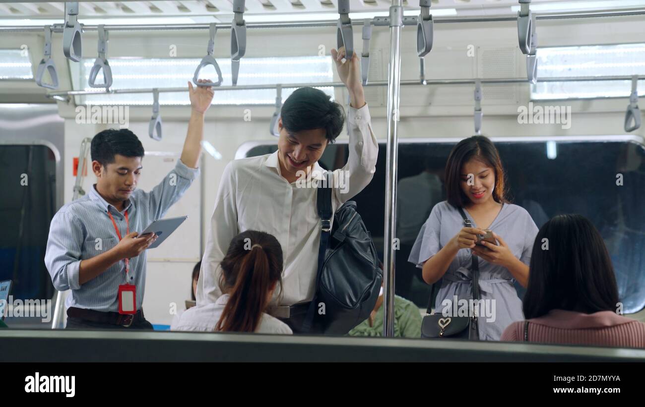 Many people crowded into a full subway hi-res stock photography and ...