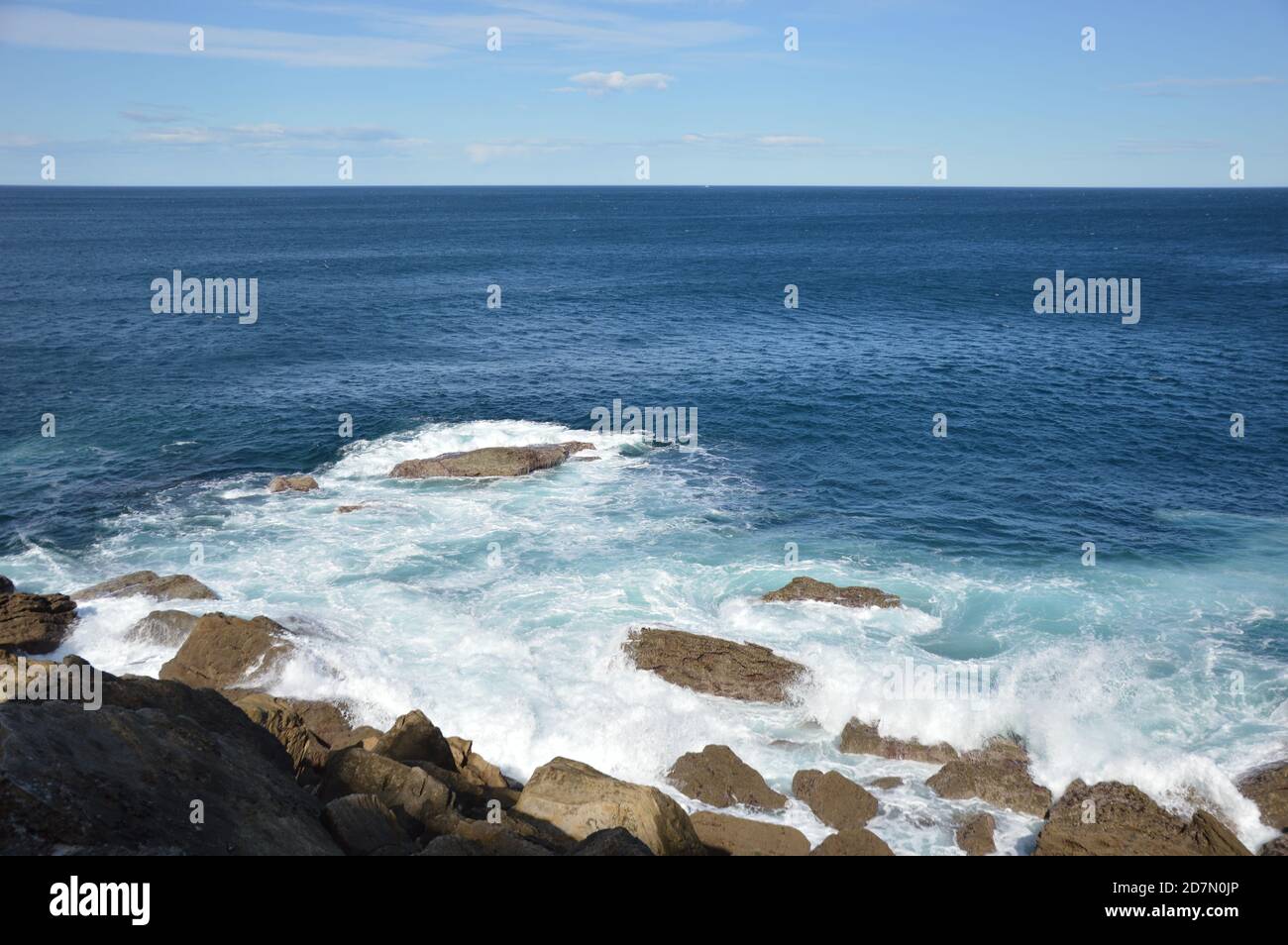 Sea surrounded by rocks under the sunlight at daytime - perfect for ...