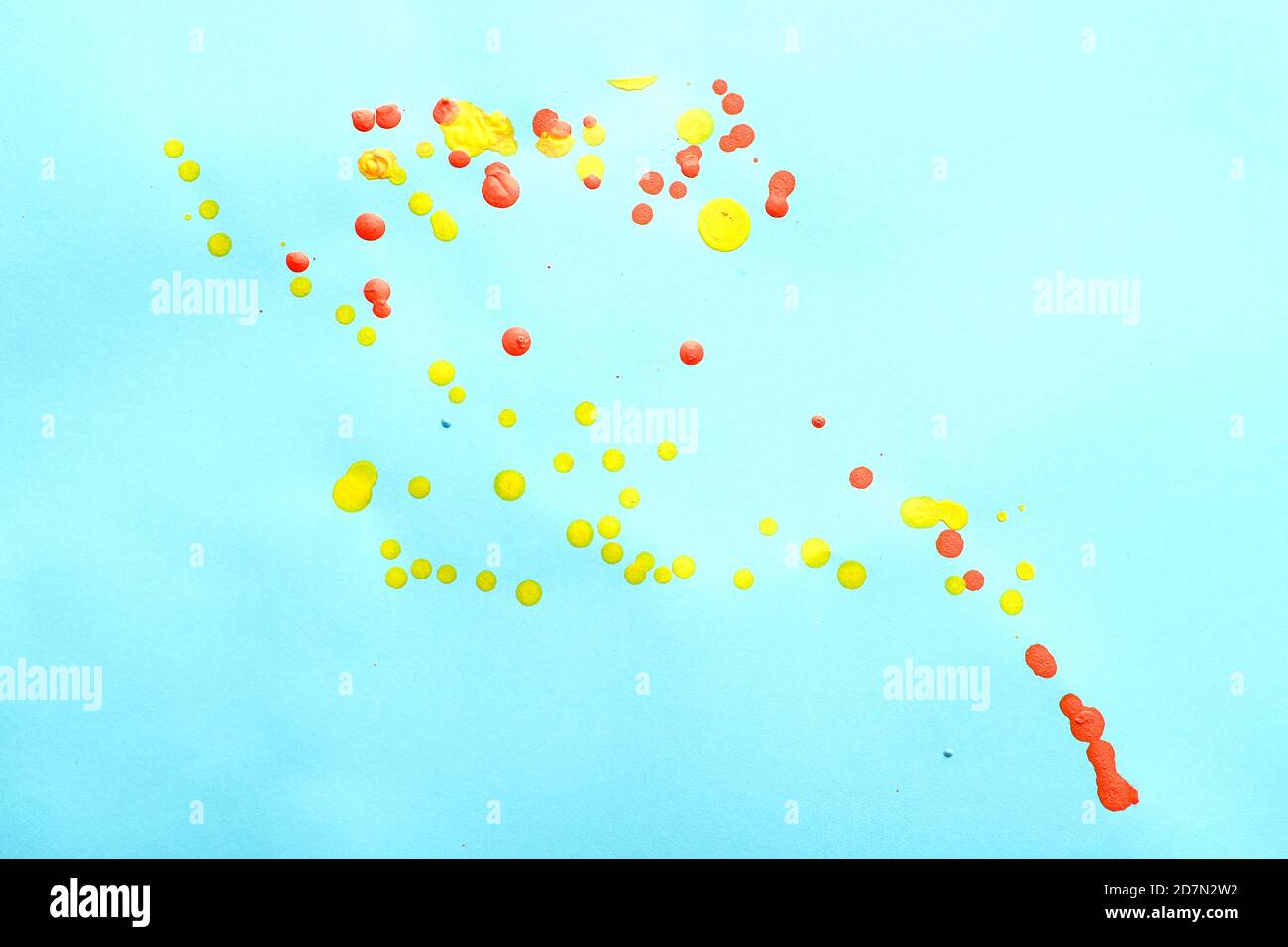 Random color oil paint splashes on blue paper Stock Photo - Alamy