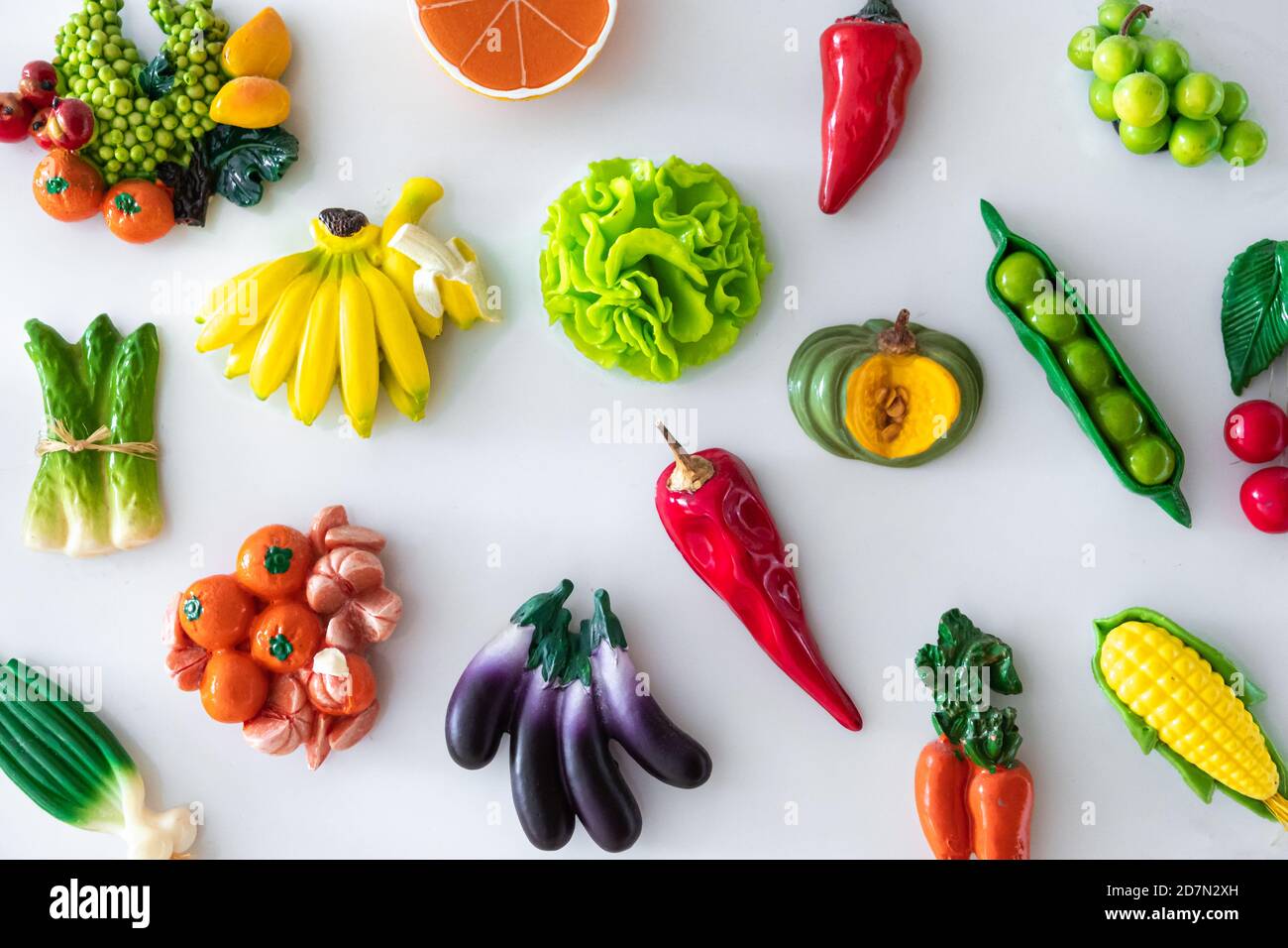 Closeup of magnets of vegetables and fruits on white background Stock ...
