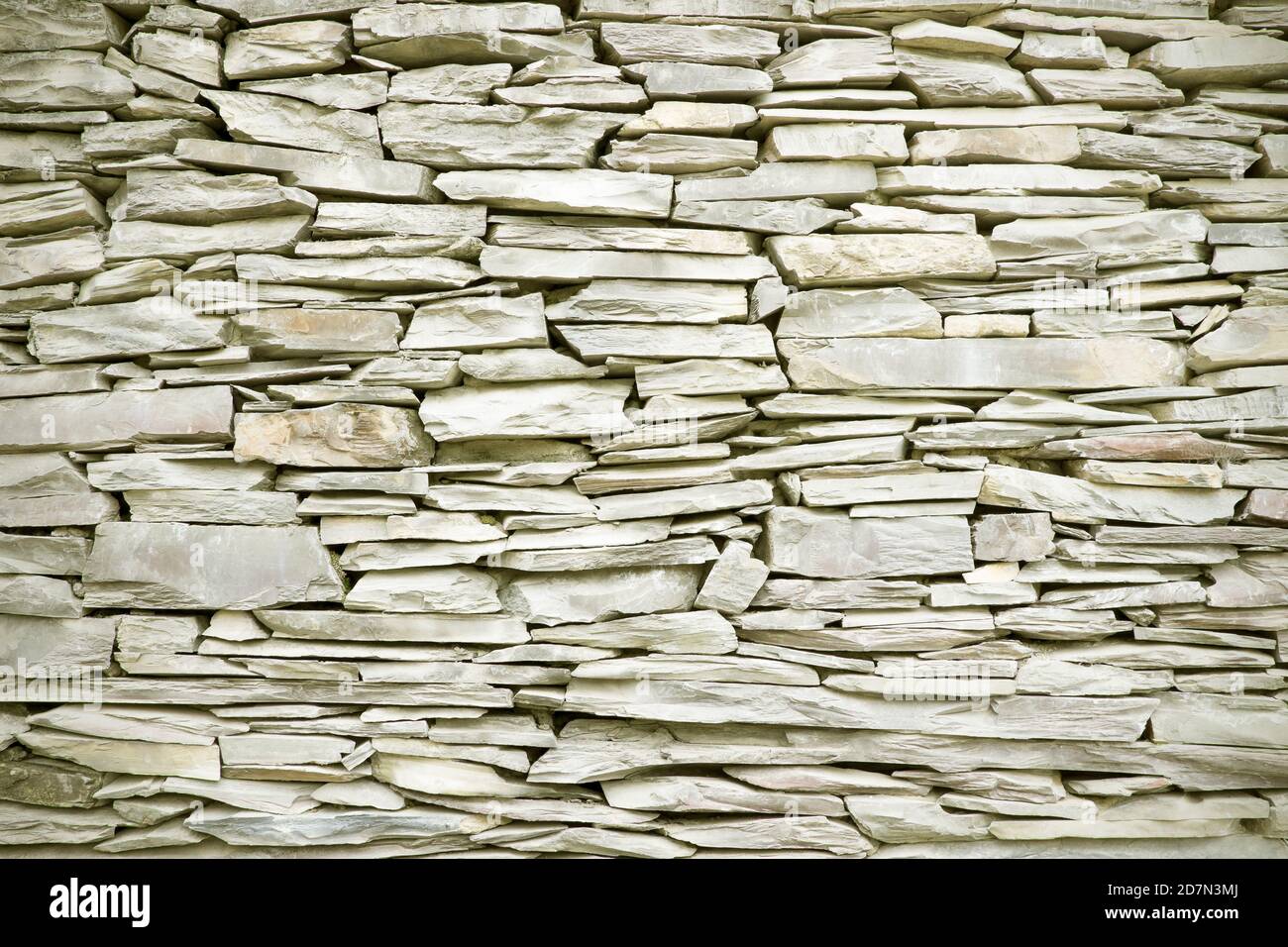 Layer of flat stones. Stone wall texture Stock Photo - Alamy