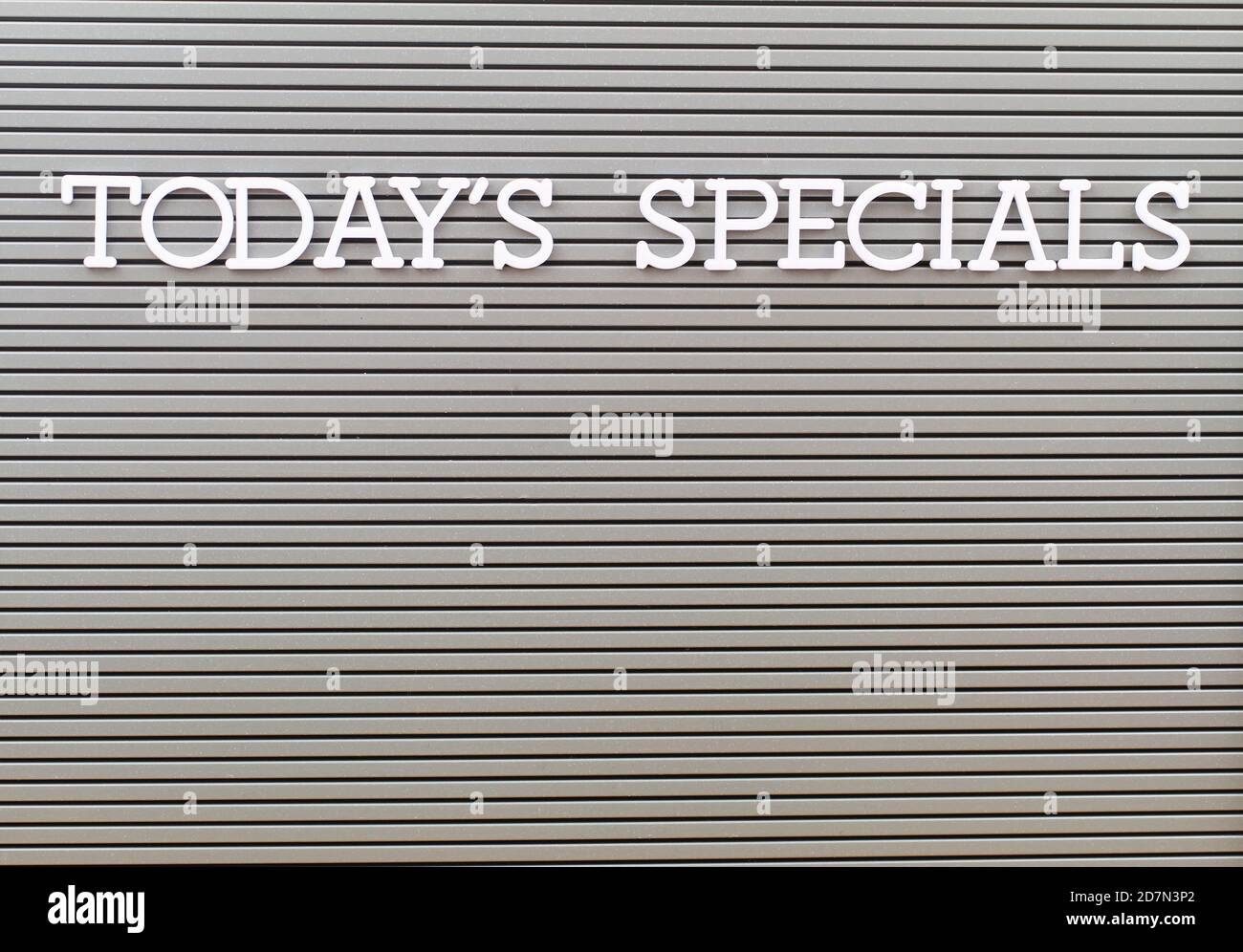 Today's specials written with white plastic letters on grey board with ...