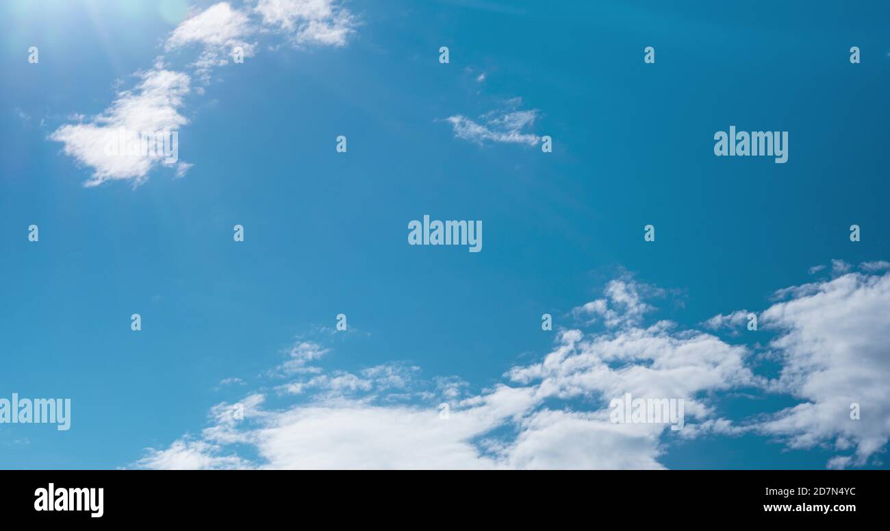 blue sky with white clouds floating fast at bright sunlight on nice ...
