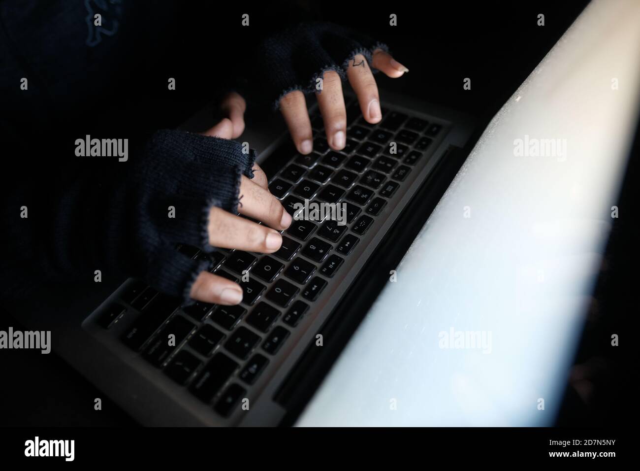 hacker hand stealing data from laptop top down Stock Photo - Alamy