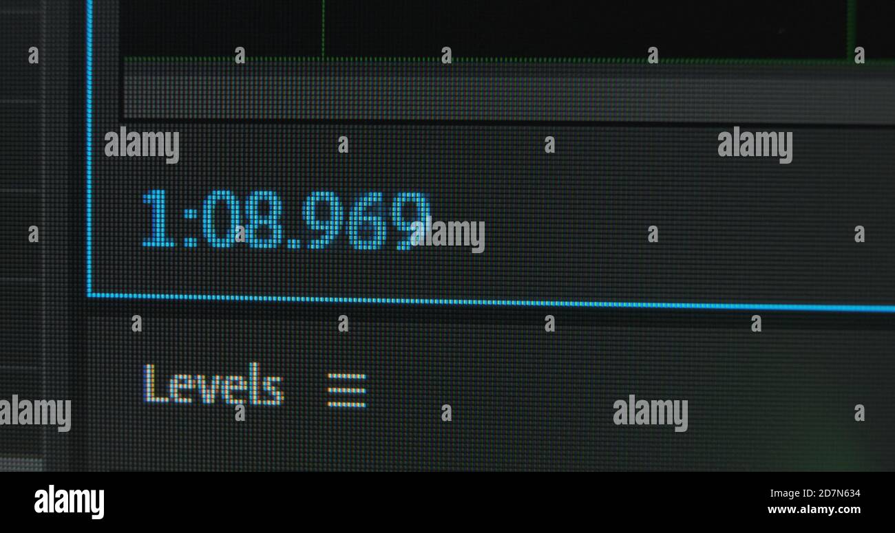Timecode blue digits change while film editor processes video sequence ...