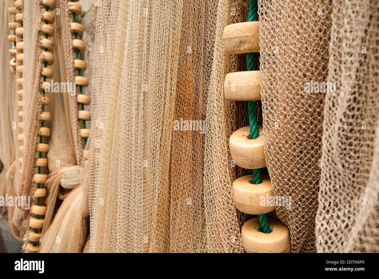 Fishing nets hanging on a wall Stock Photo - Alamy