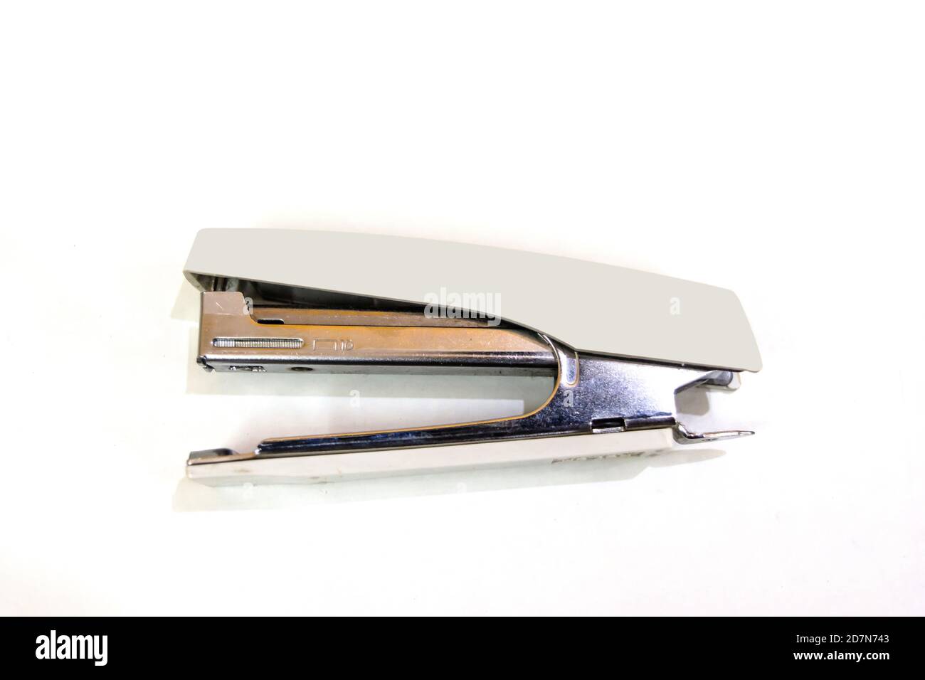 cream color stapler isolated on a white background Stock Photo - Alamy