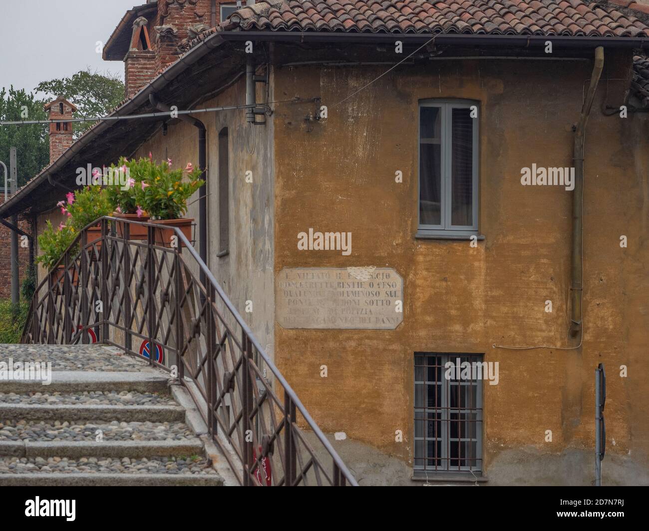 pedestrian bridge near an old farmhouse crosses the river.Ticino Park ...