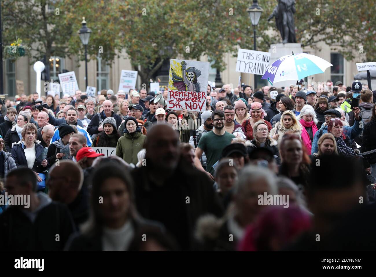 People pass through Trafalgar Square, London, protesting against the ...