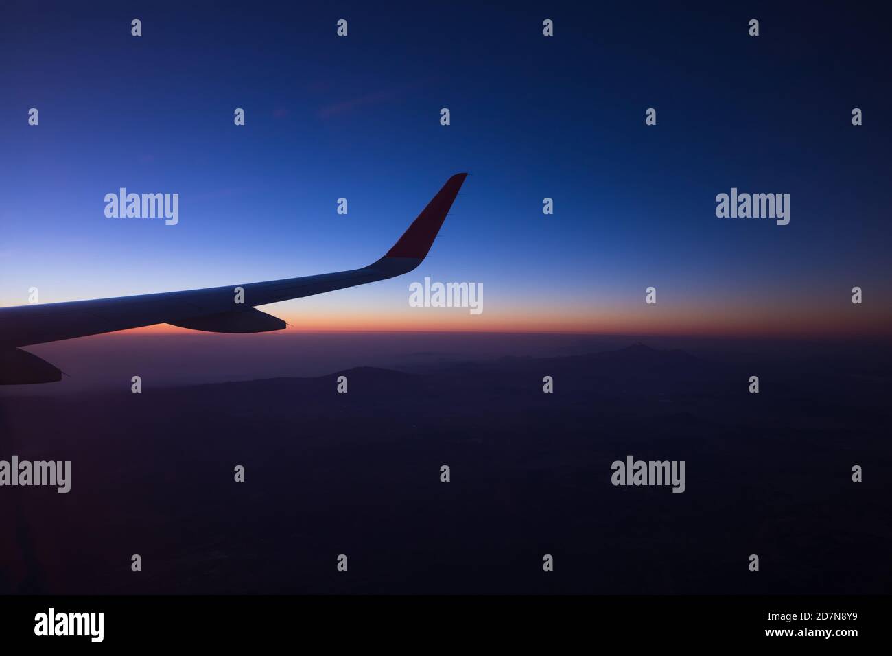 Sunrise on window plane wiew, with mountains on the background in the ...