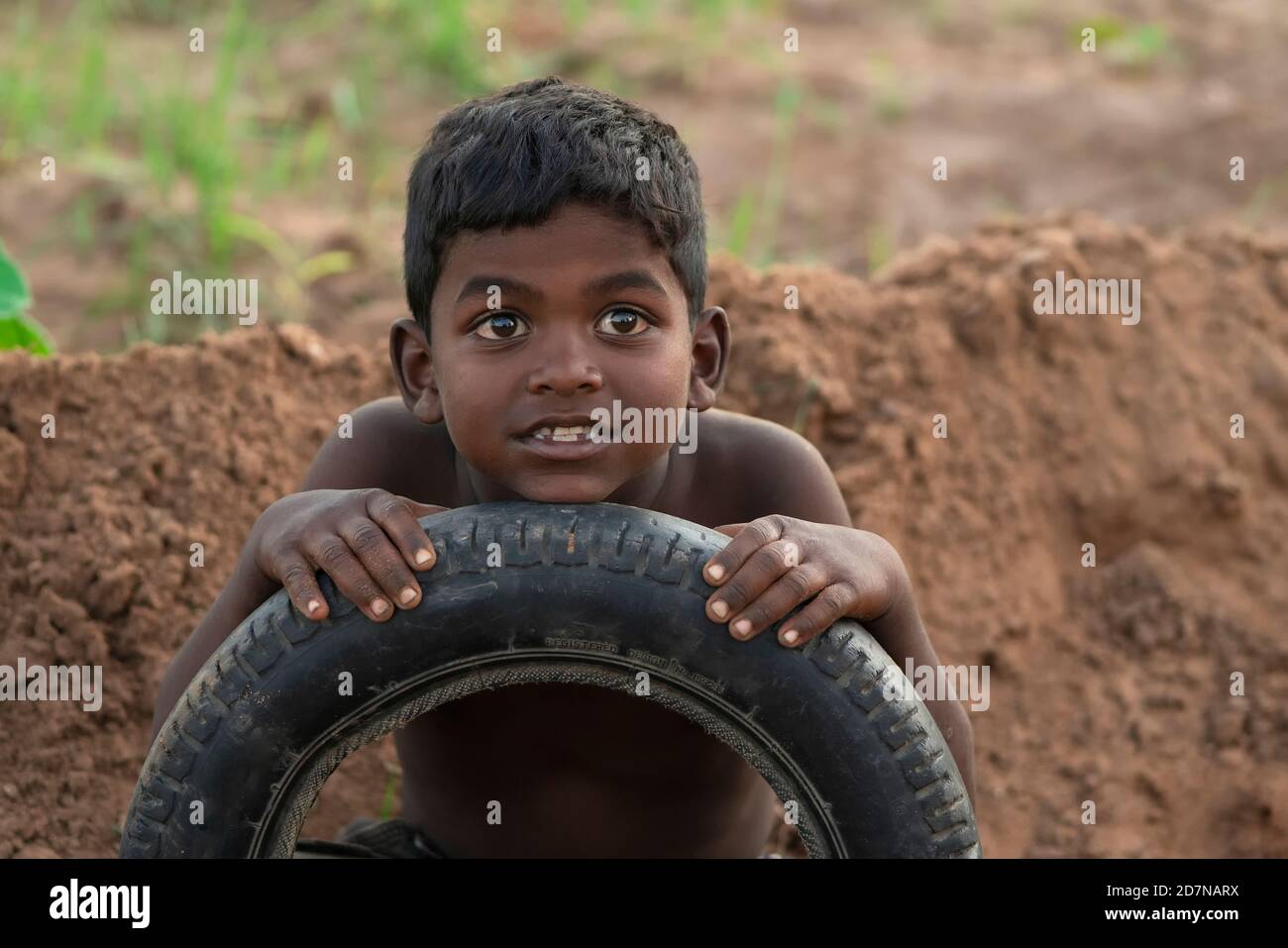 Kutch ,22 August, 2019 , Portrait of poor young villager boy playing ...