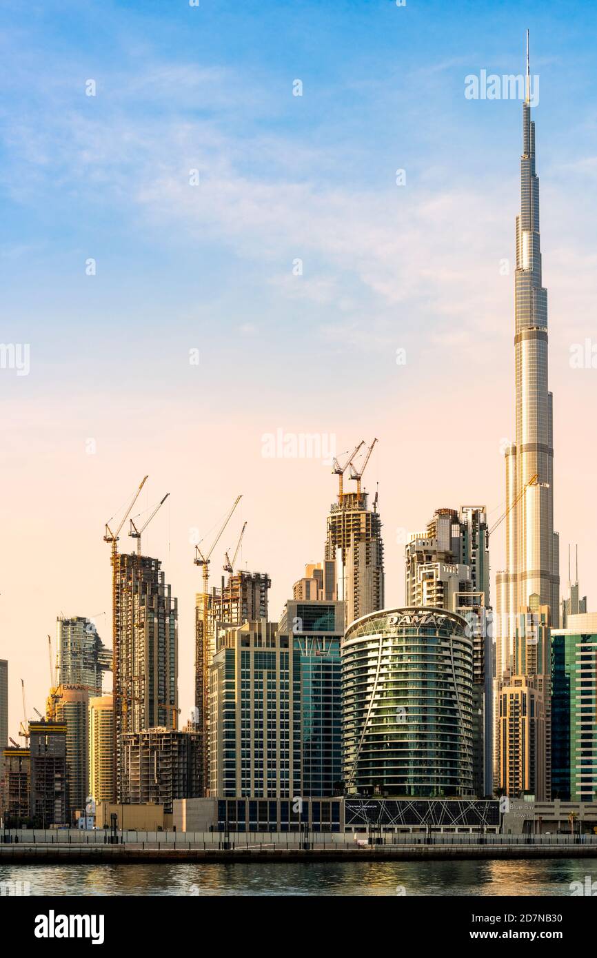 Stunning view of the Dubai skyline at sunset with the magnificent Burj ...