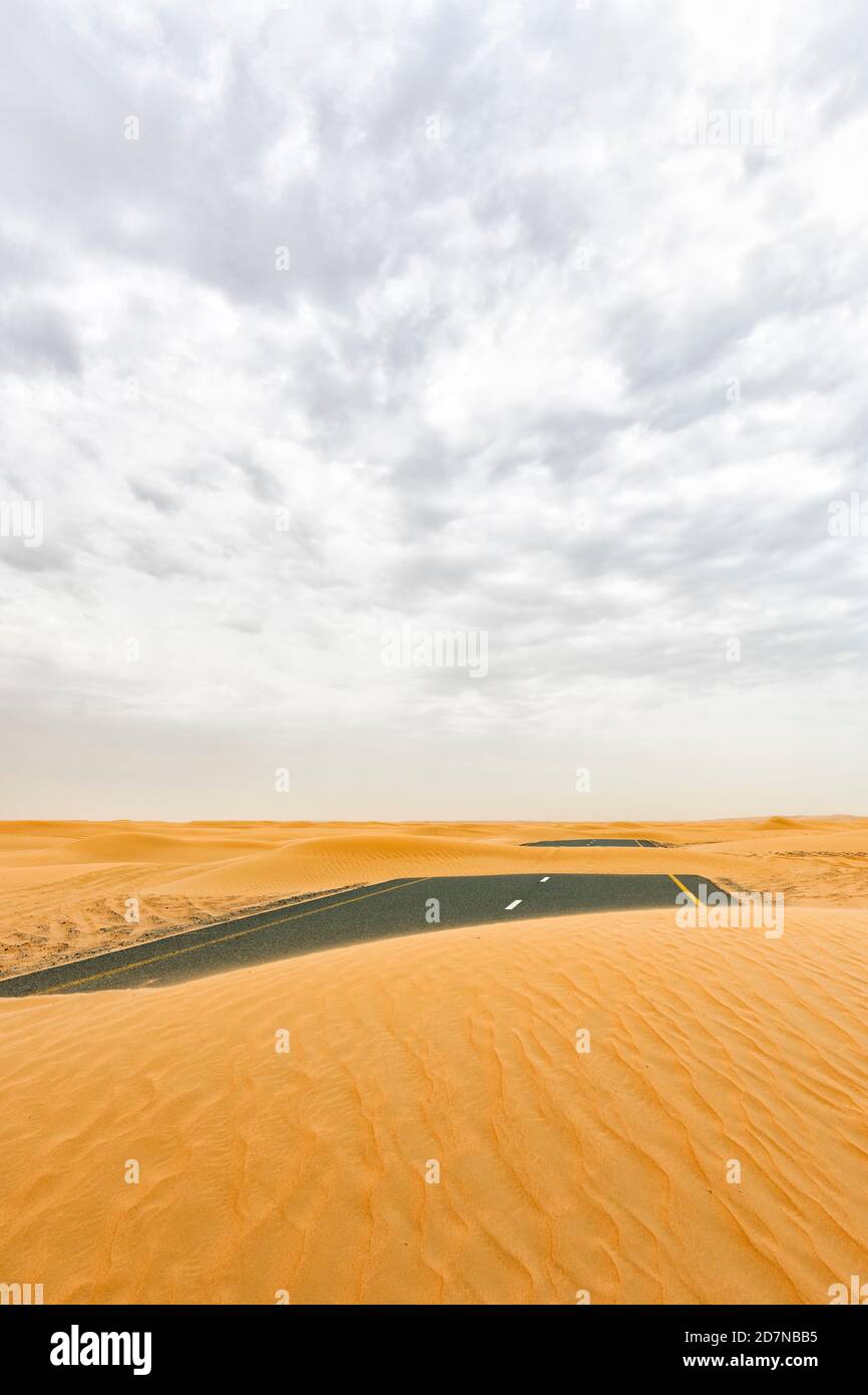 Road through sand dunes hi-res stock photography and images - Alamy
