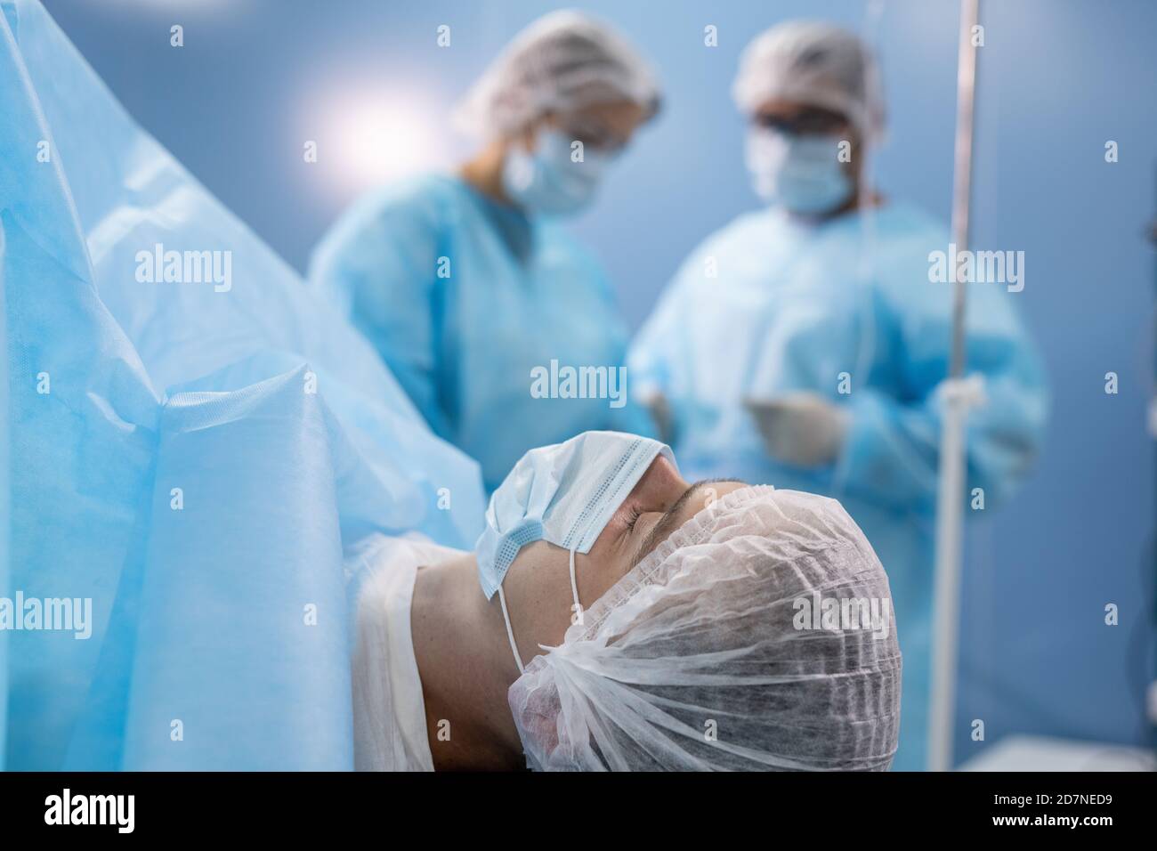 Patient lying on an operating table hi-res stock photography and images ...